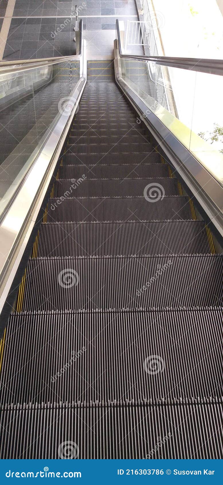 An Escalator Is A Moving Staircase Which Carries People Between Floors ...