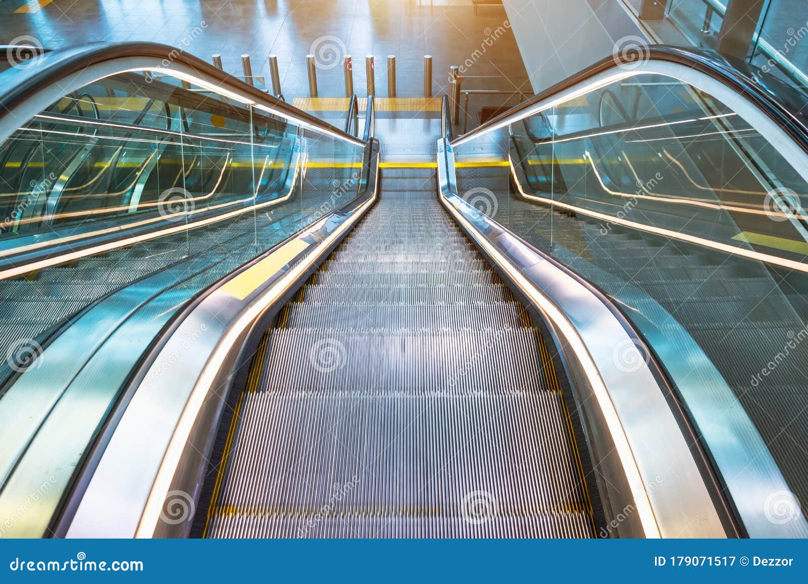 Descent On The Escalator In The Metro. Light Boxes Along The Tunnel ...