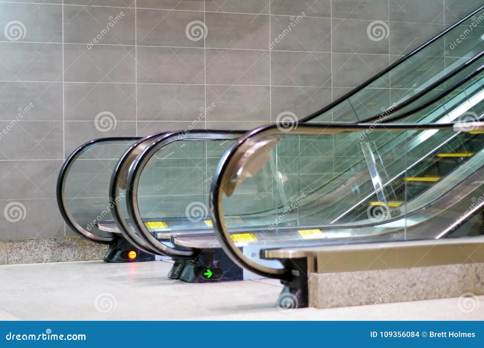 Escalator View from Side with Tiled Wall Stock Photo - Image of black ...