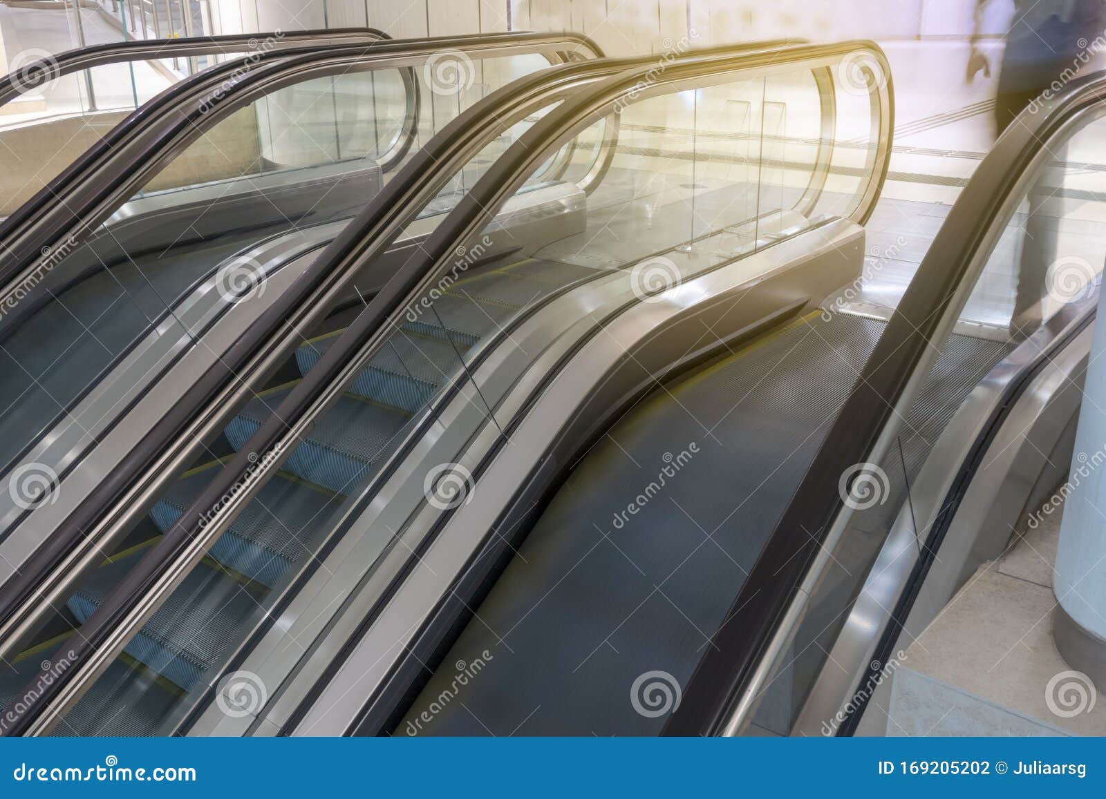 3 Escalators in Modern Building. Person is Stepping into Escalator ...