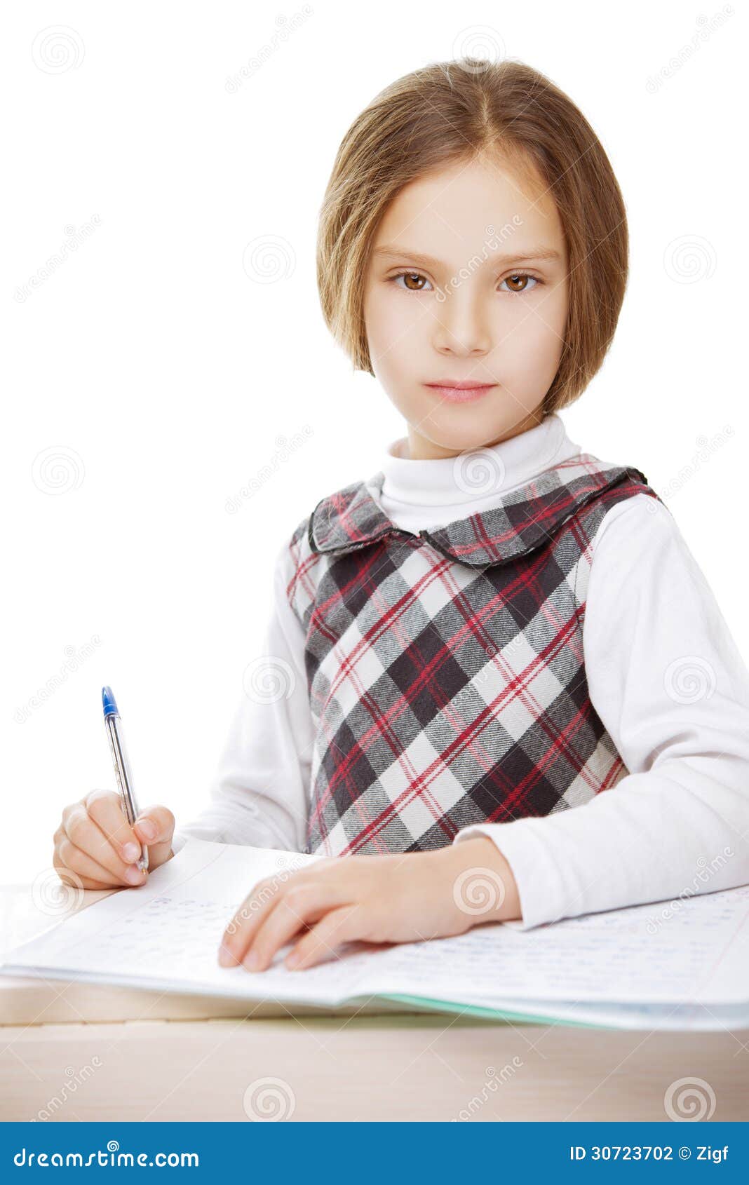 Escrita Da Menina Em Trabalhos De Casa Do Caderno Foto de Stock ...