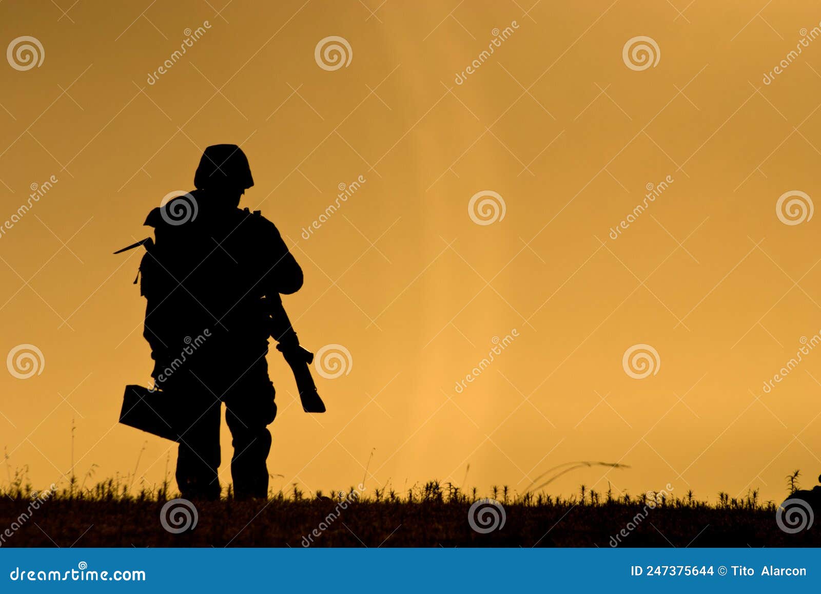 Soldier Loading His Rifle and Ammunition Against the Light Stock Photo ...