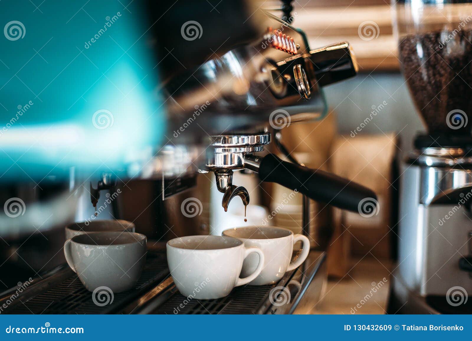 Espresso Flows Down from the Coffee Machine in To Two Cups of Coffee ...