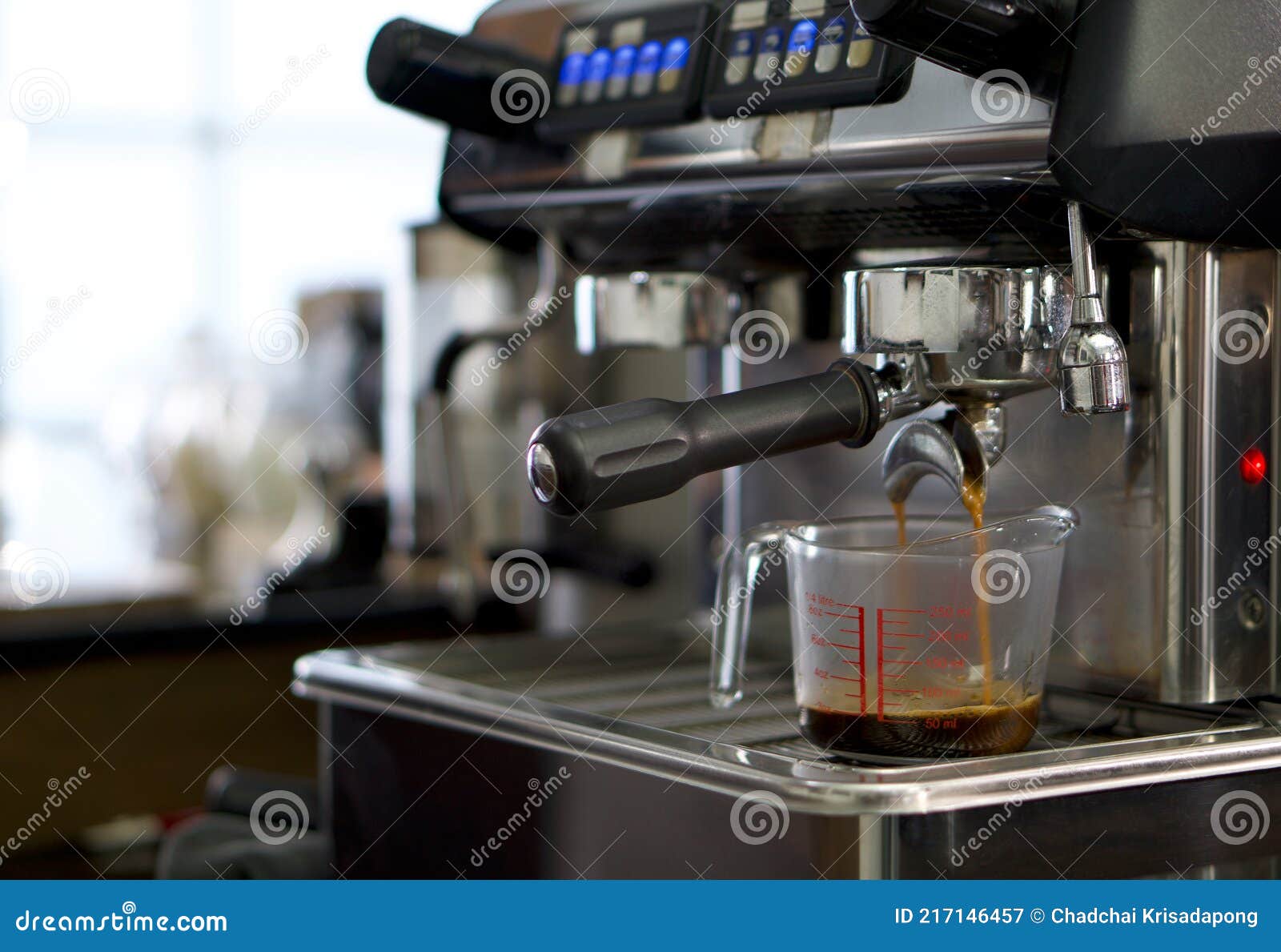 Espresso Machine Pouring Coffee in Measuring Cup. Close Up Stock Image ...