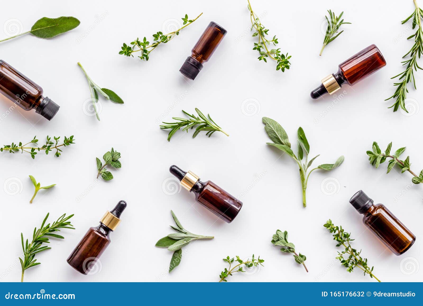 Essential Oils and Fresh Herbs on White Background Top View Pattern ...
