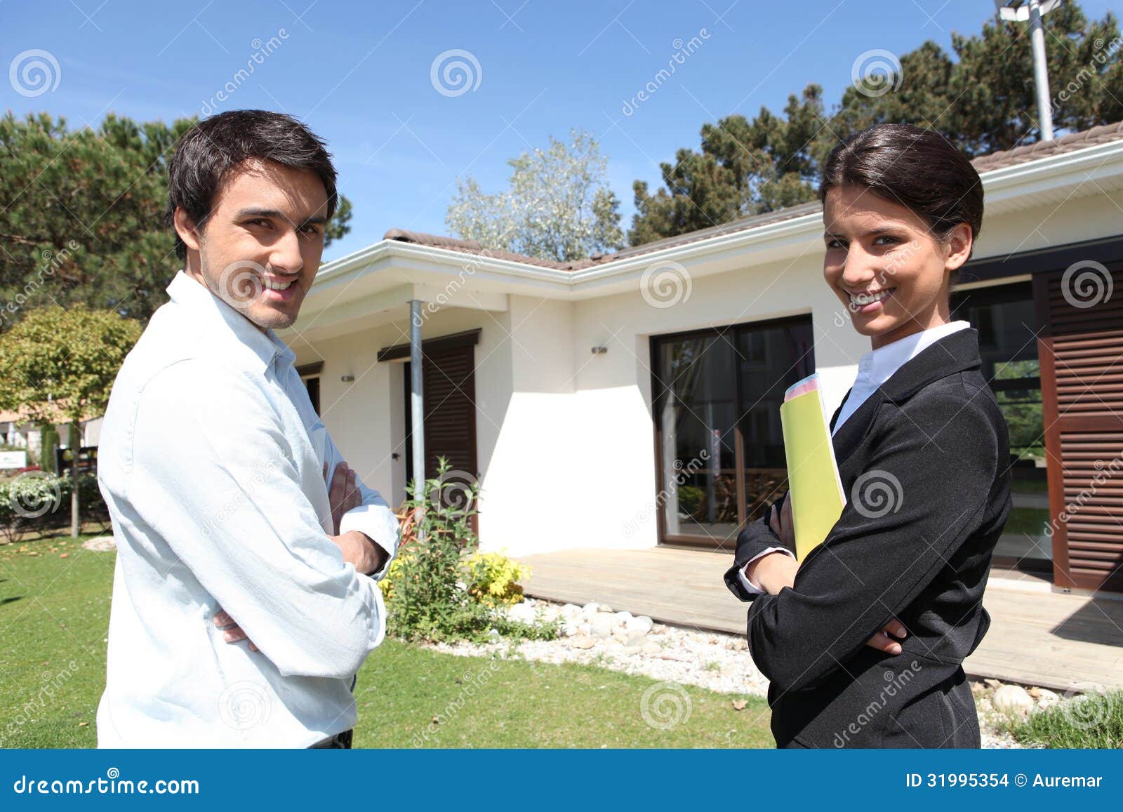 Estate agent with a client stock photo. Image of open - 31995354