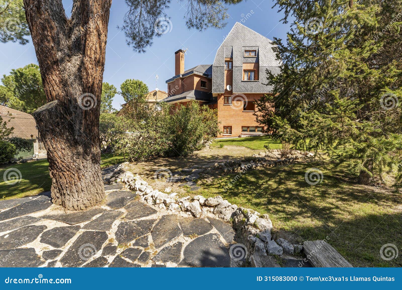 Estate with Slate Tile Paths and a Chalet with a Characteristic Roof of ...