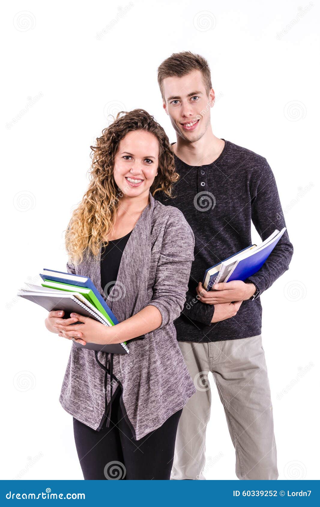 Estudiantes Universitarios Jovenes Con Los Libros Foto de archivo ...