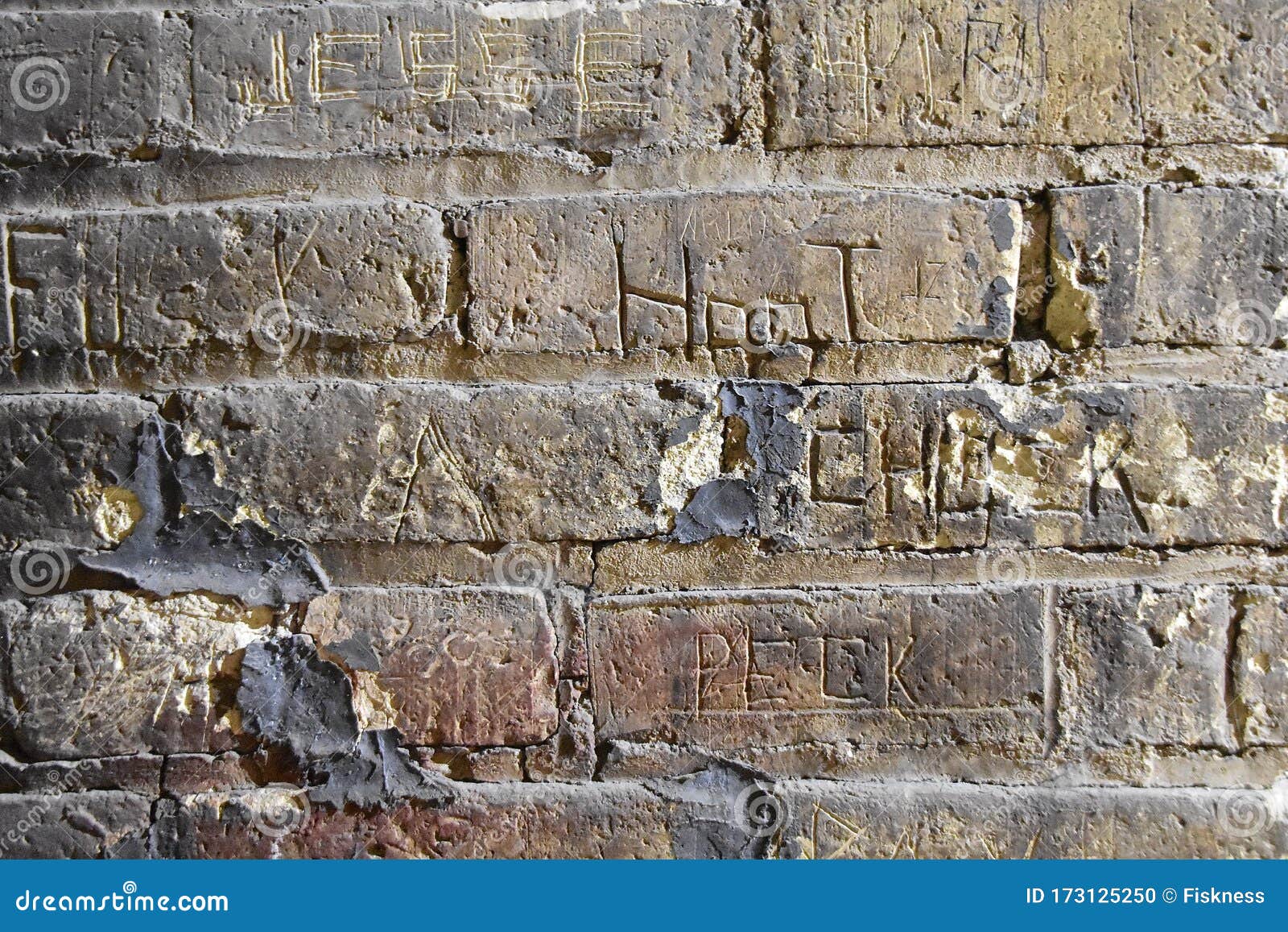 Initials, Names, and Designs Carved into Bricks of an Outside Building ...