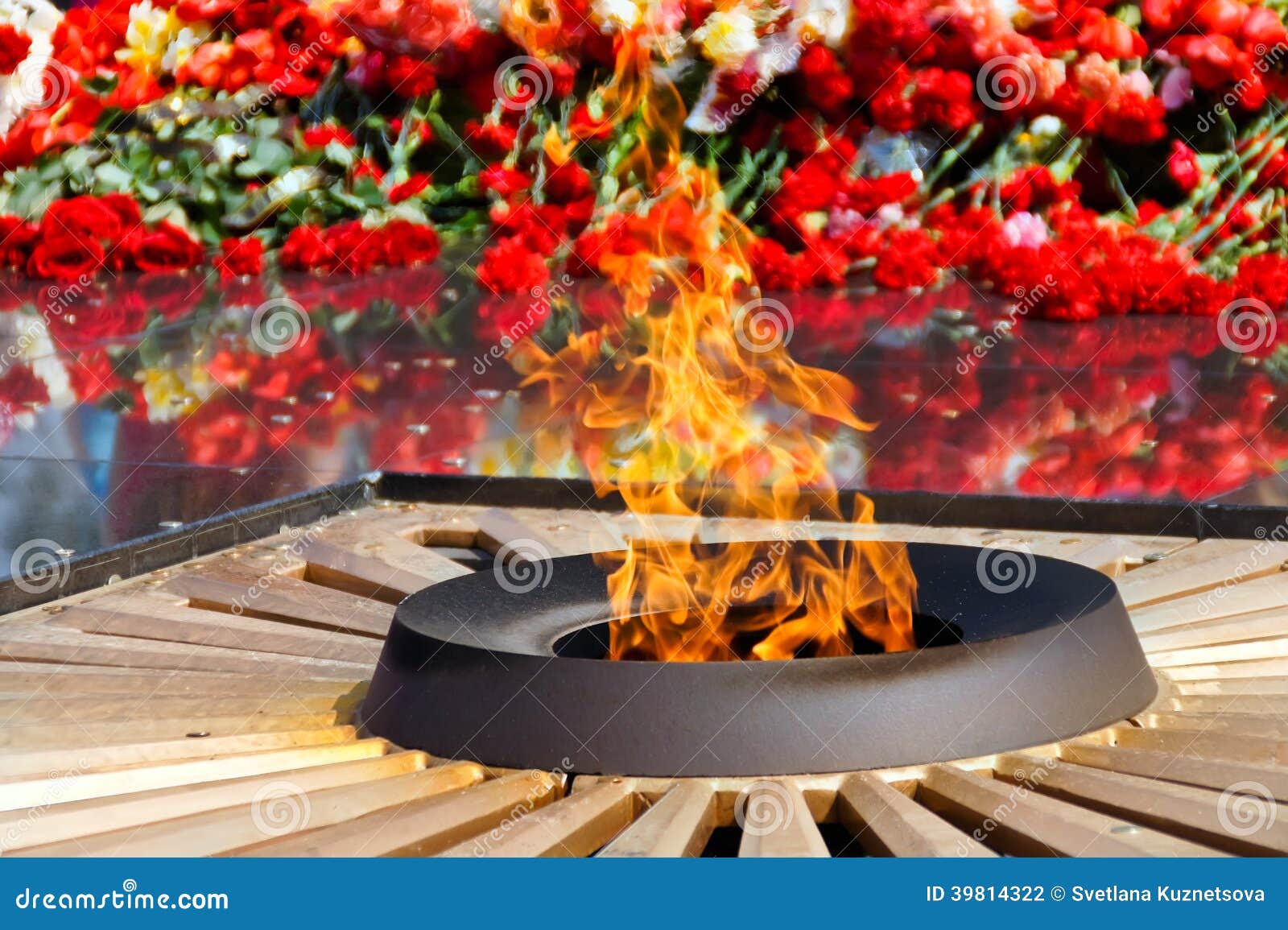Eternal Fire. The Flames Are Reflected In The Granite. Royalty-Free ...