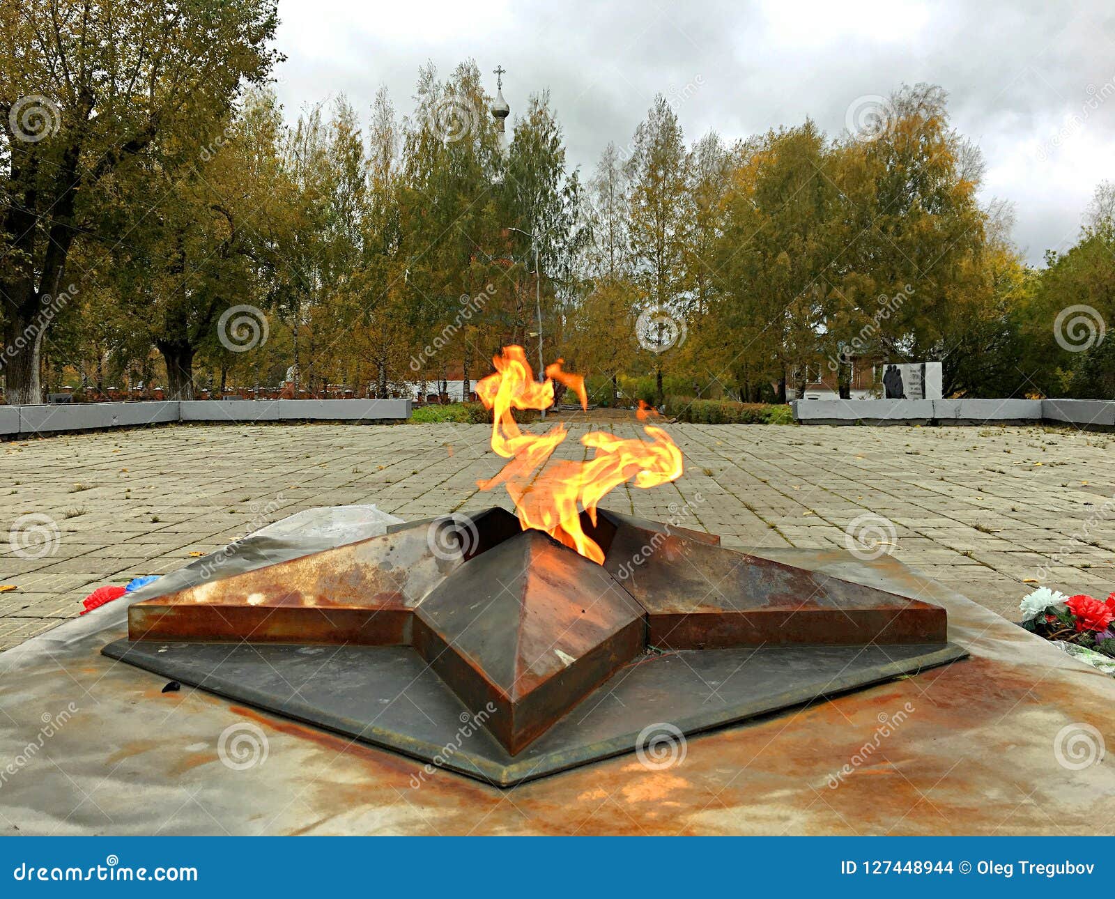 Eternal Flame in Front of the Temple Stock Photo - Image of lake, bench ...