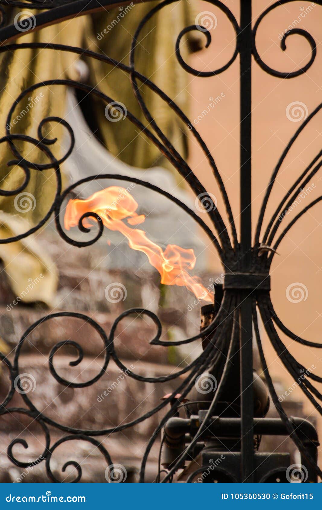 An Eternal Flame Looking Thru a Wrought Iron Gate Stock Photo - Image ...