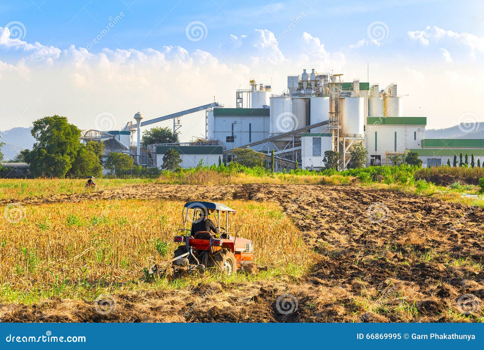 Ethanol Industrial Refinery with Farm Tractors in the Foreground ...