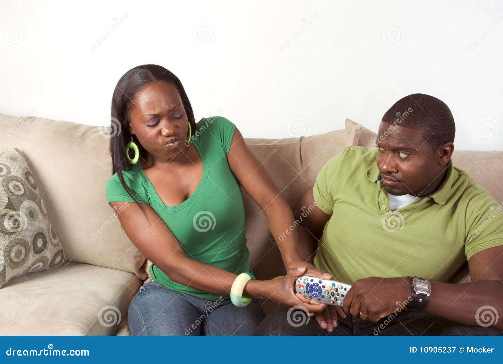 Ethnic Couple Fighting Over TV Remote Control Stock Image - Image of ...