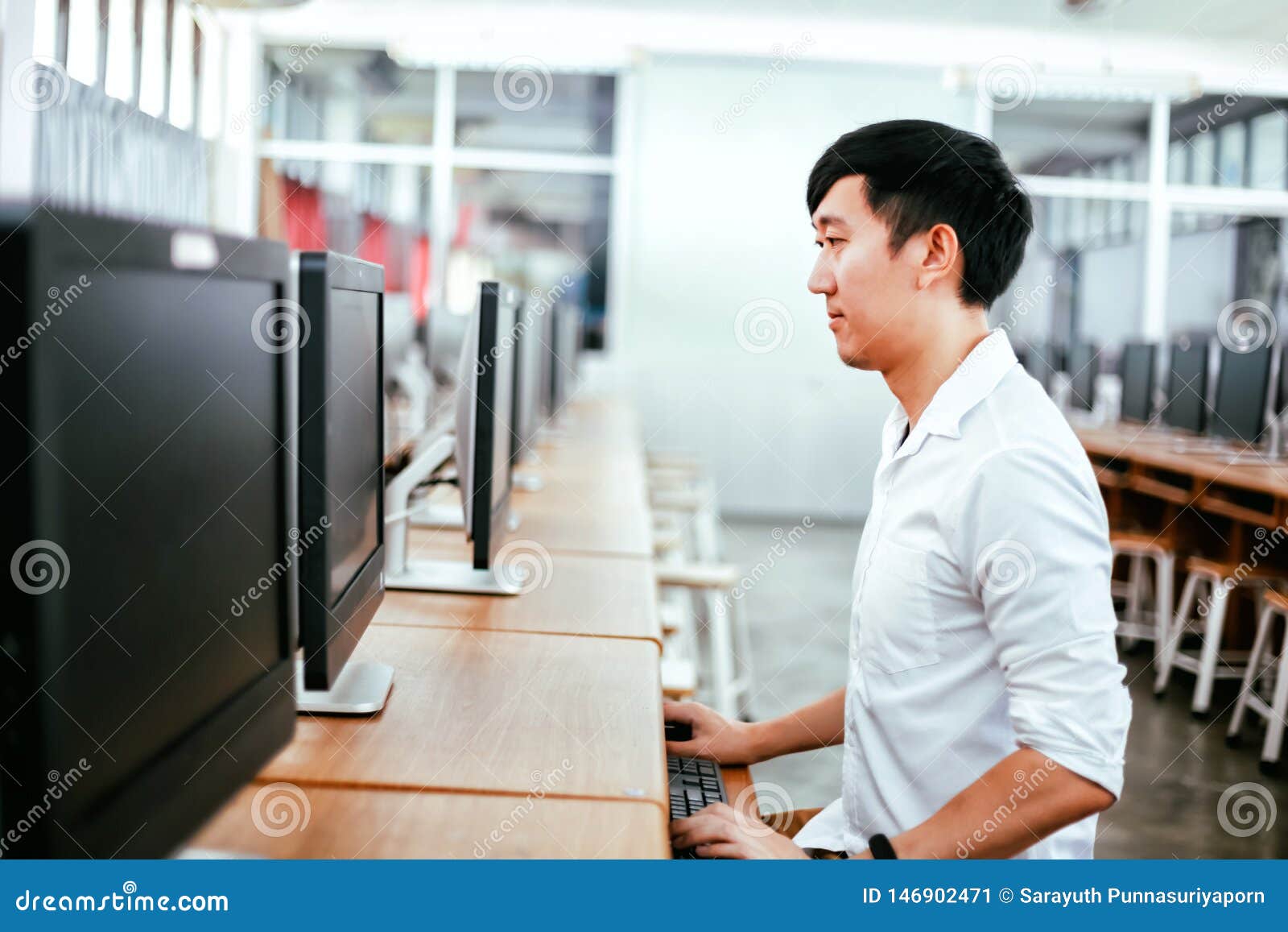 Ethnic Man Using Computer in Classroom Stock Image - Image of company ...