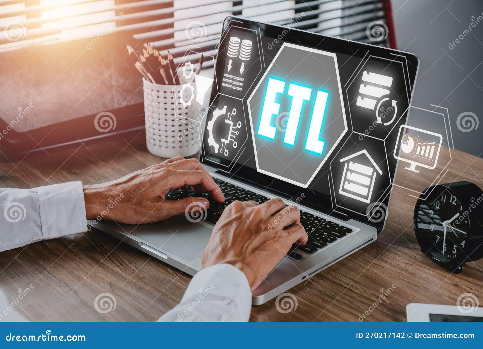 Person Using Laptop with Extract Transform Load Icon on Virtual Screen ...