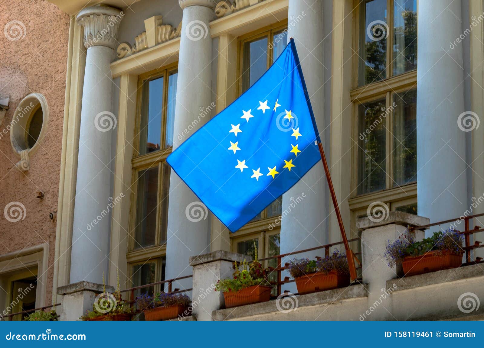 EU Flag stock image. Image of sunny, institution, facade - 158119461