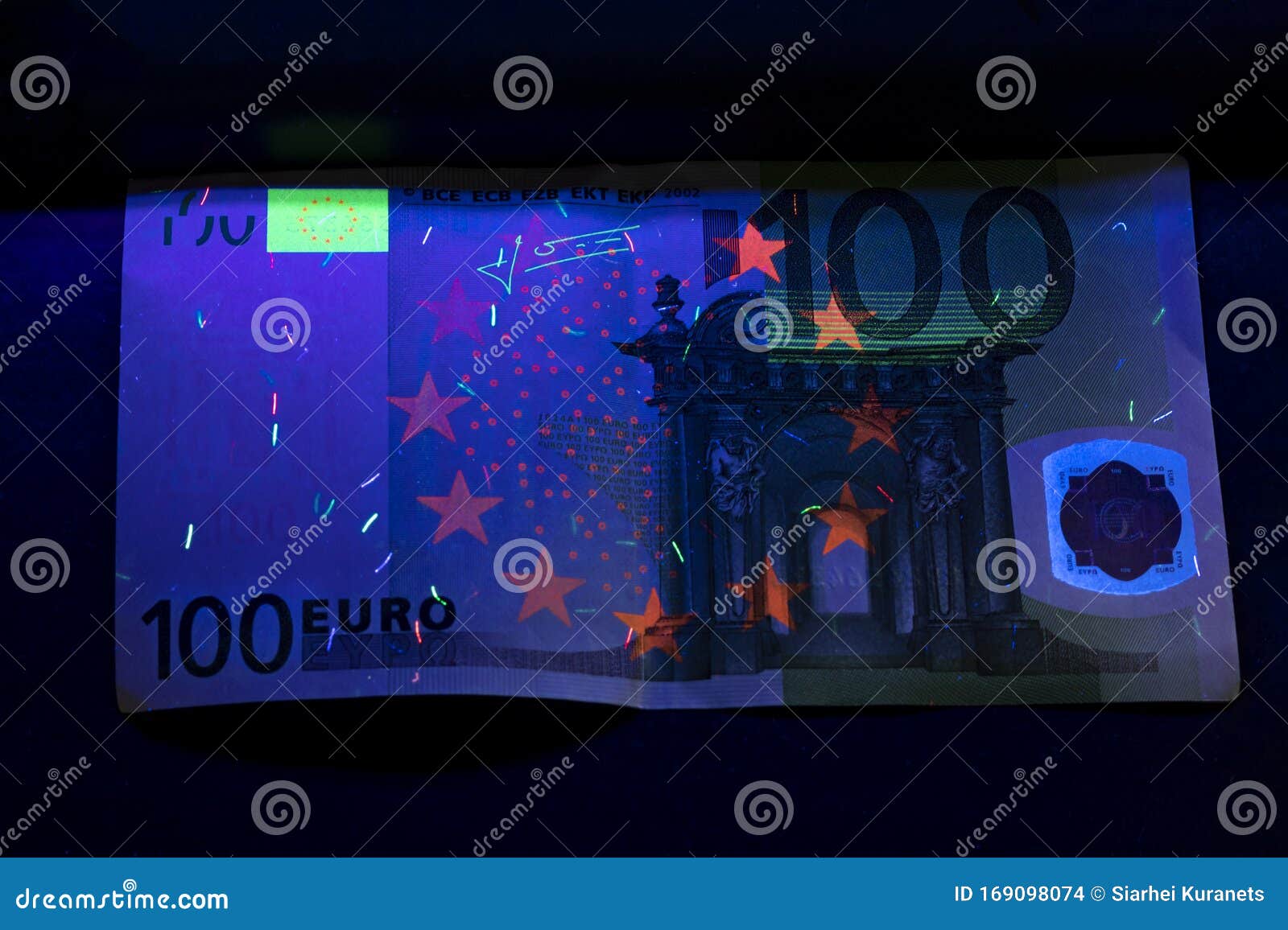 100 Euro Banknote. Lying in the Ultraviolet To Verify the Authenticity ...