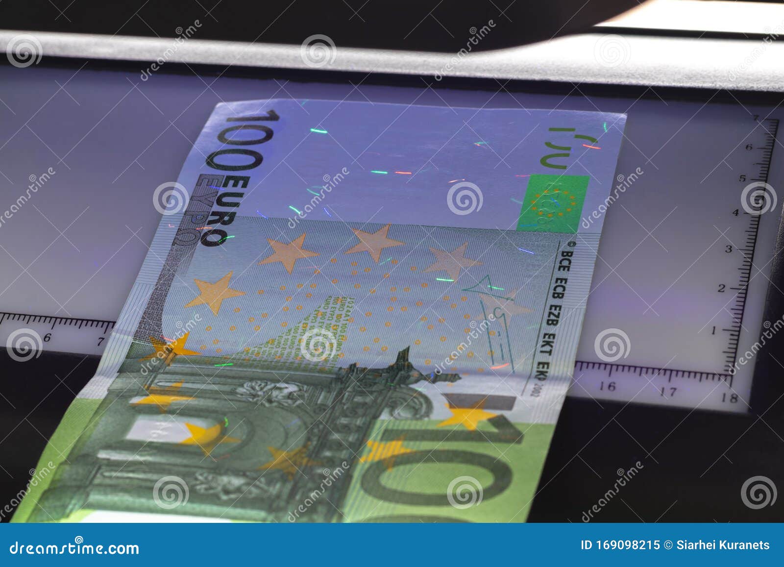 100 Euro Banknote. Lying in the Ultraviolet To Verify the Authenticity ...
