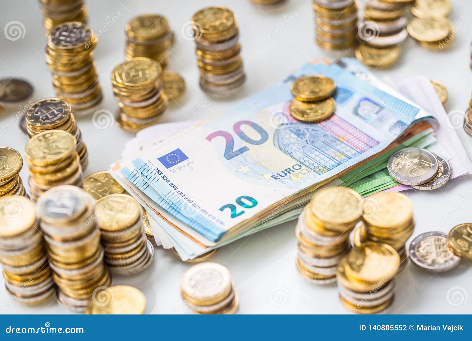 Euro Banknotes and Coins Togetger on White Table - Close-up Stock Photo ...