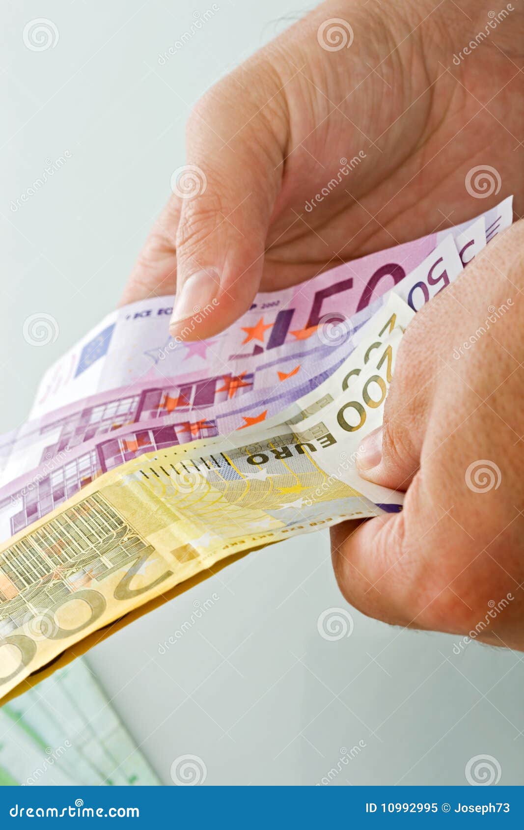 Euro banknotes in the hand stock image. Image of investment - 10992995