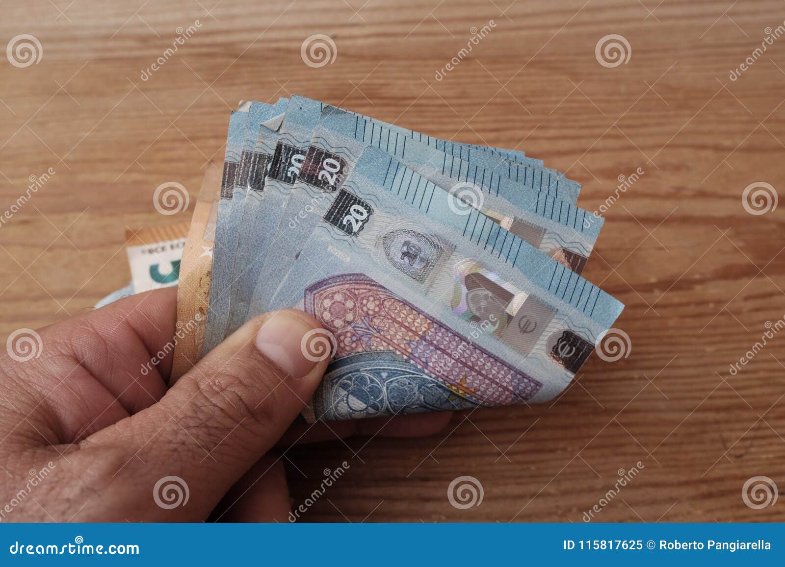 Euro banknotes in the hand stock image. Image of cash - 115817625