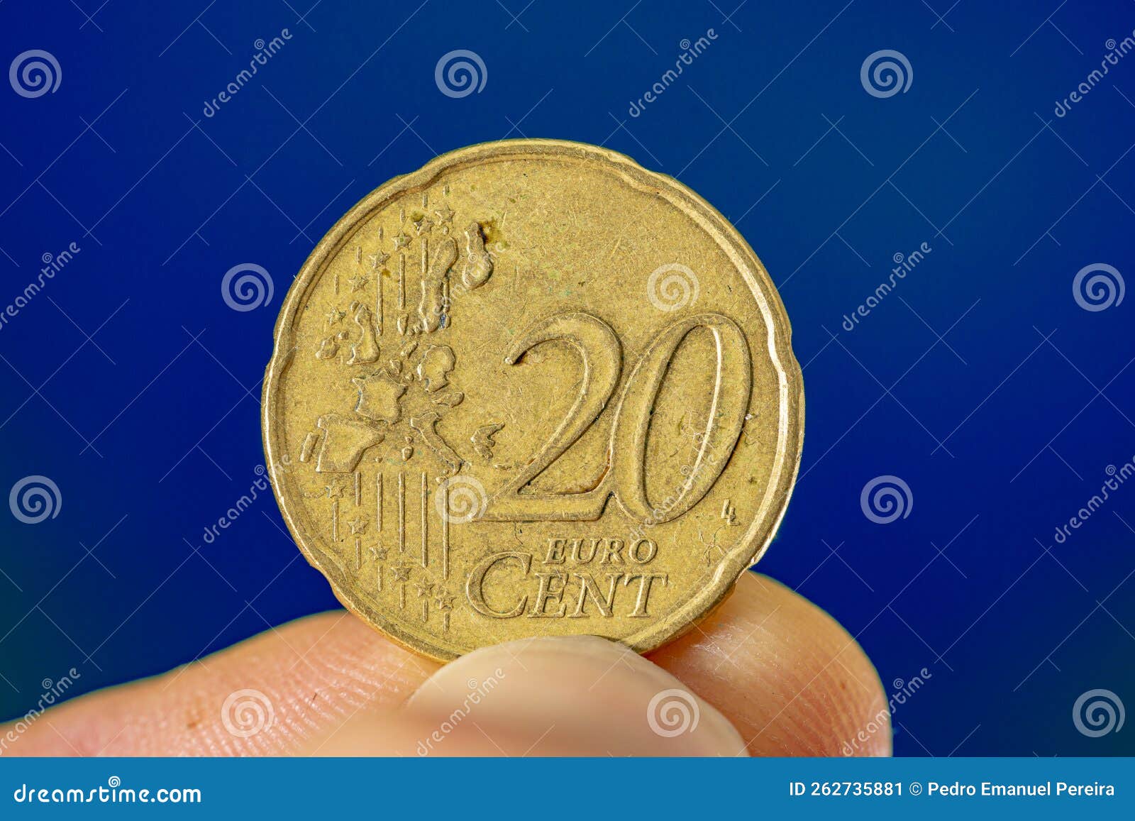 20 Euro Cent Coin Face Held between Thumb and Index Finger. Stock Image ...