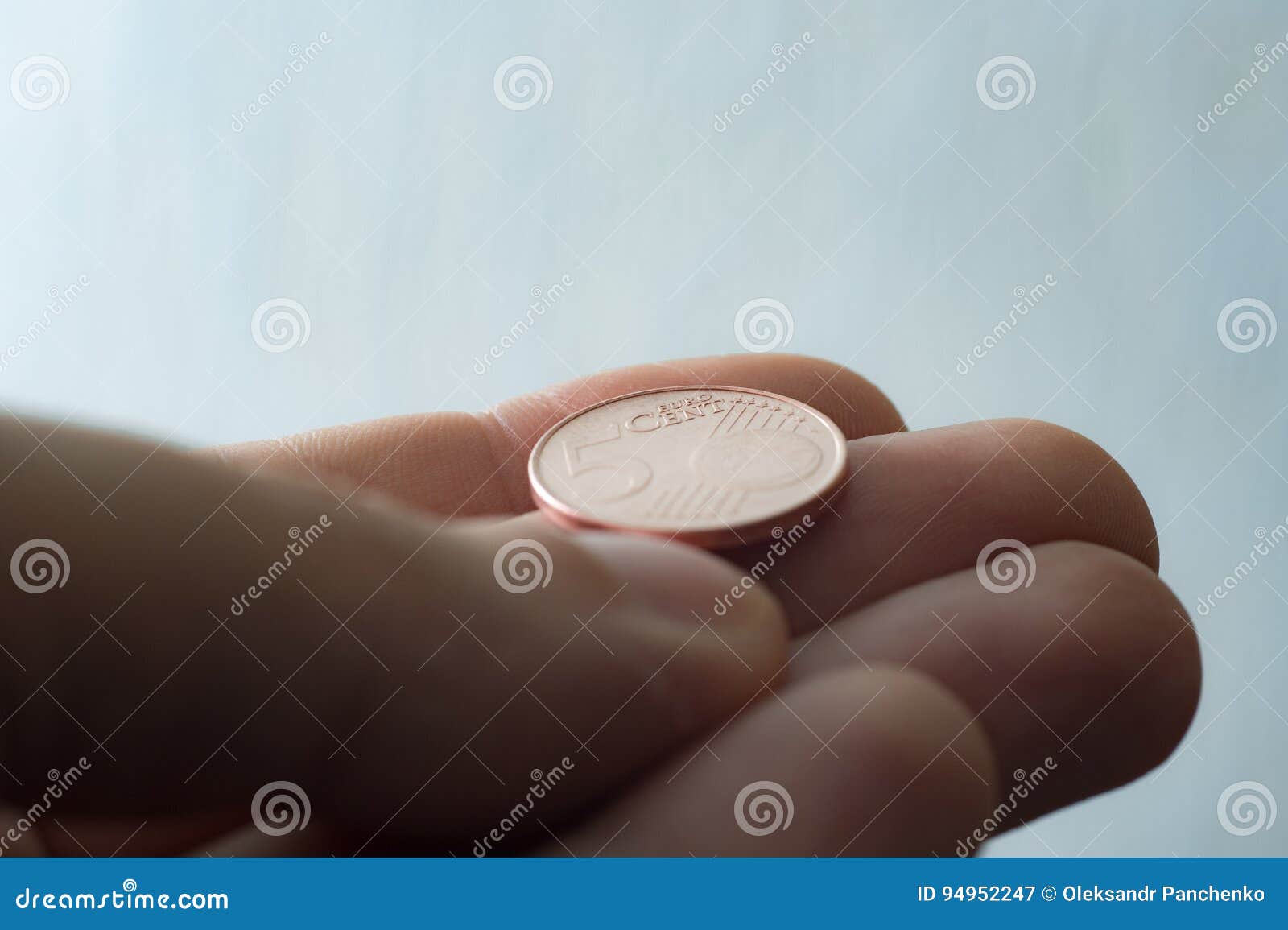 Euro coin on finger tips stock image. Image of closeup - 94952247