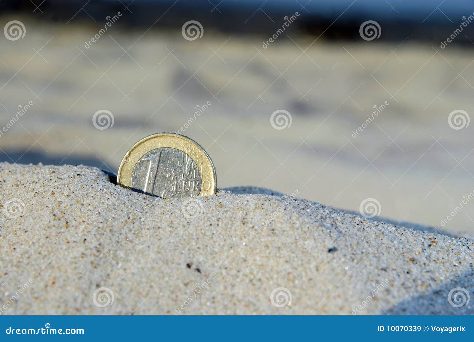 Euro coin in the sand stock image. Image of sand, coast - 10070339