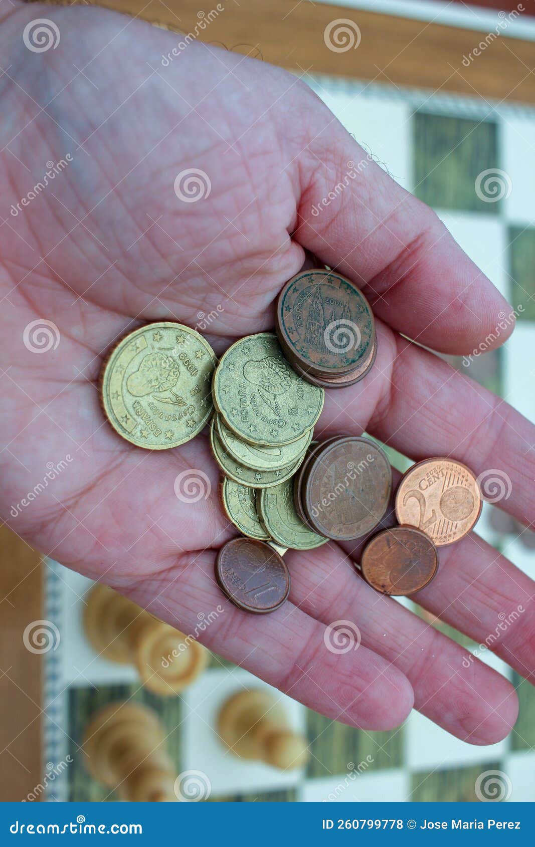 Euro coins in my left hand stock photo. Image of coin - 260799778