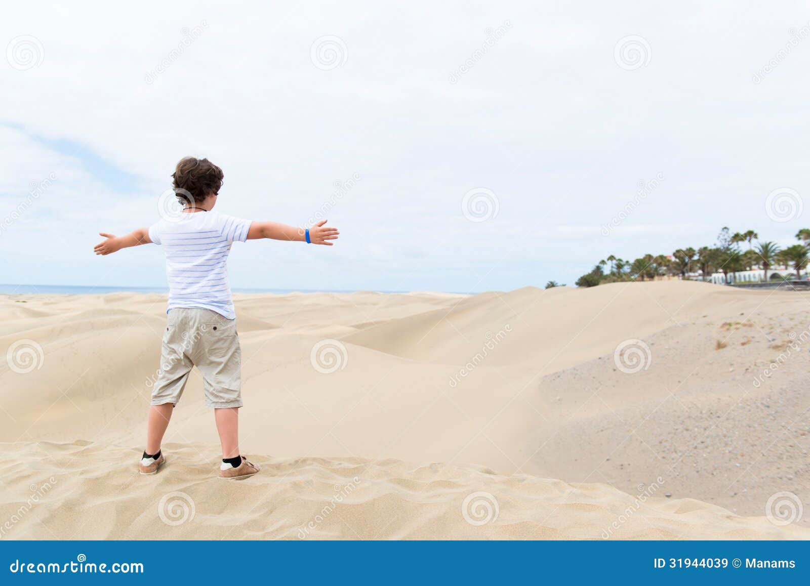 European Boy with Open Arms Stock Image - Image of standing, sand: 31944039