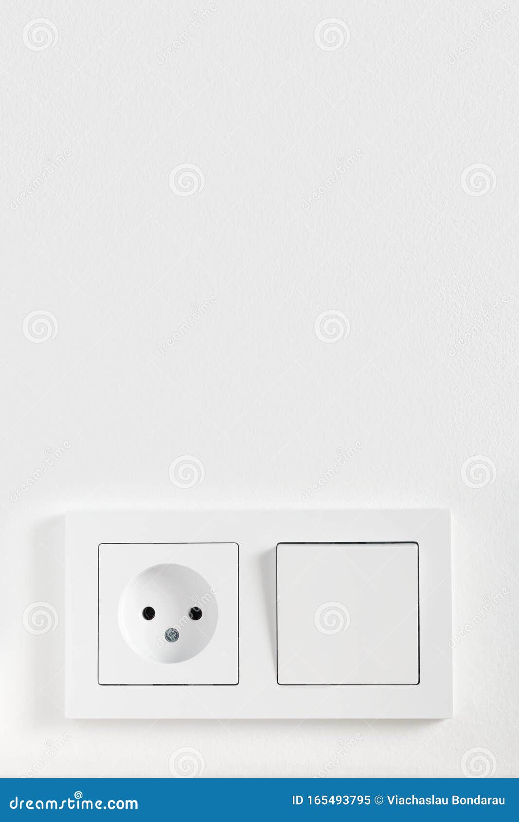 European Electric Light Switch and Socket on the Painted White Wall ...
