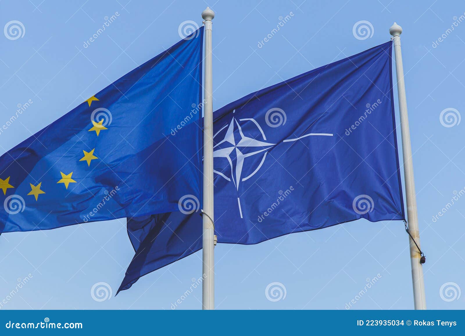 European Union and NATO Flags in Blue Sky Background Stock Photo ...