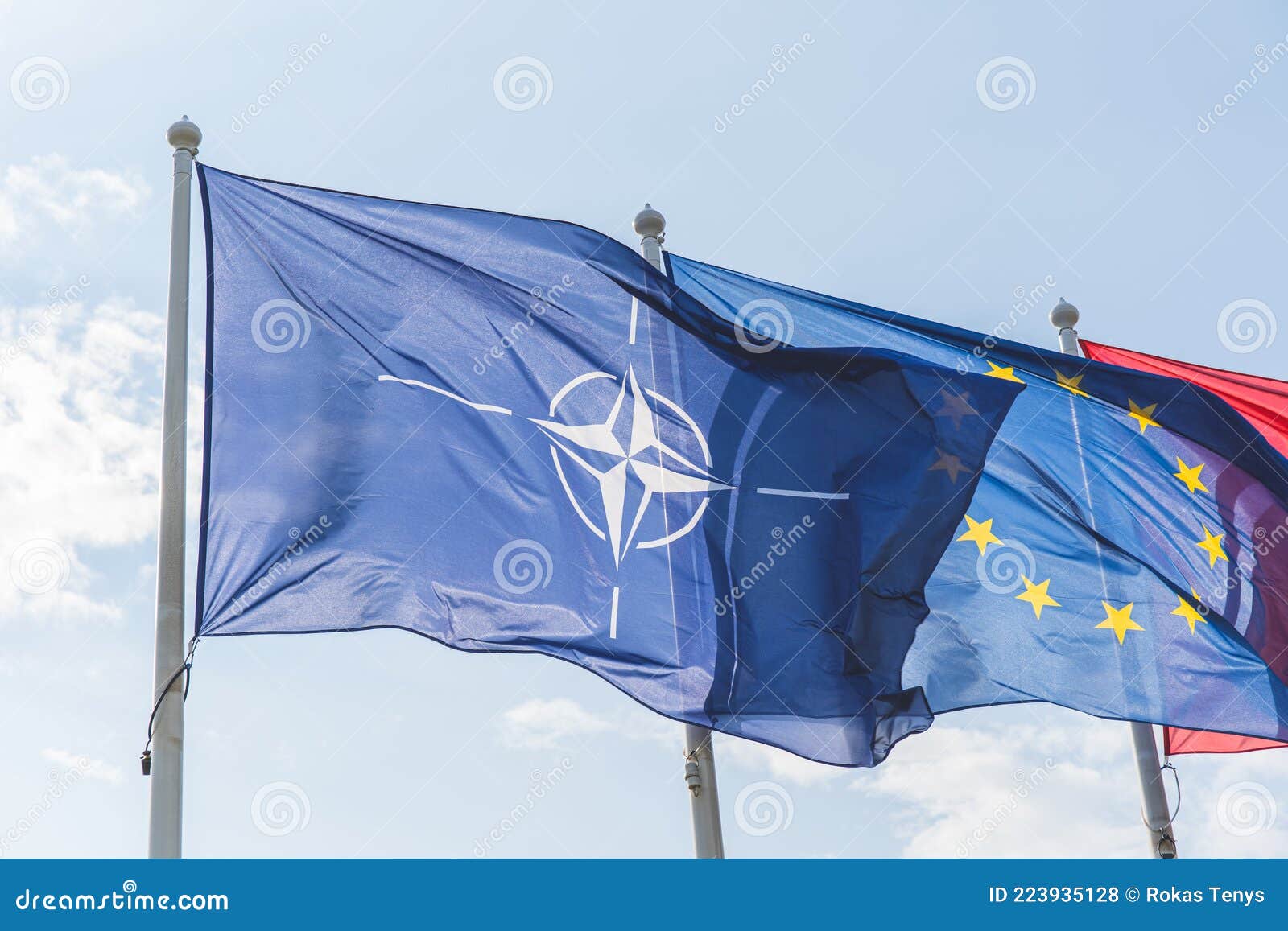 European Union and NATO Flags in Blue Sky Background Stock Photo ...