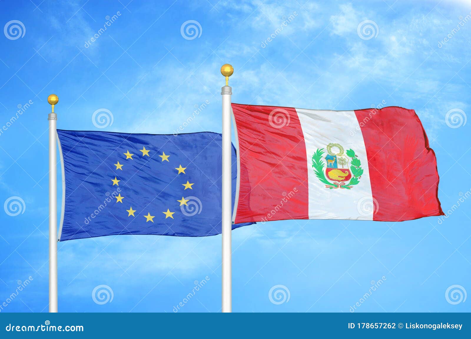 European Union and Peru Two Flags on Flagpoles and Blue Cloudy Sky ...