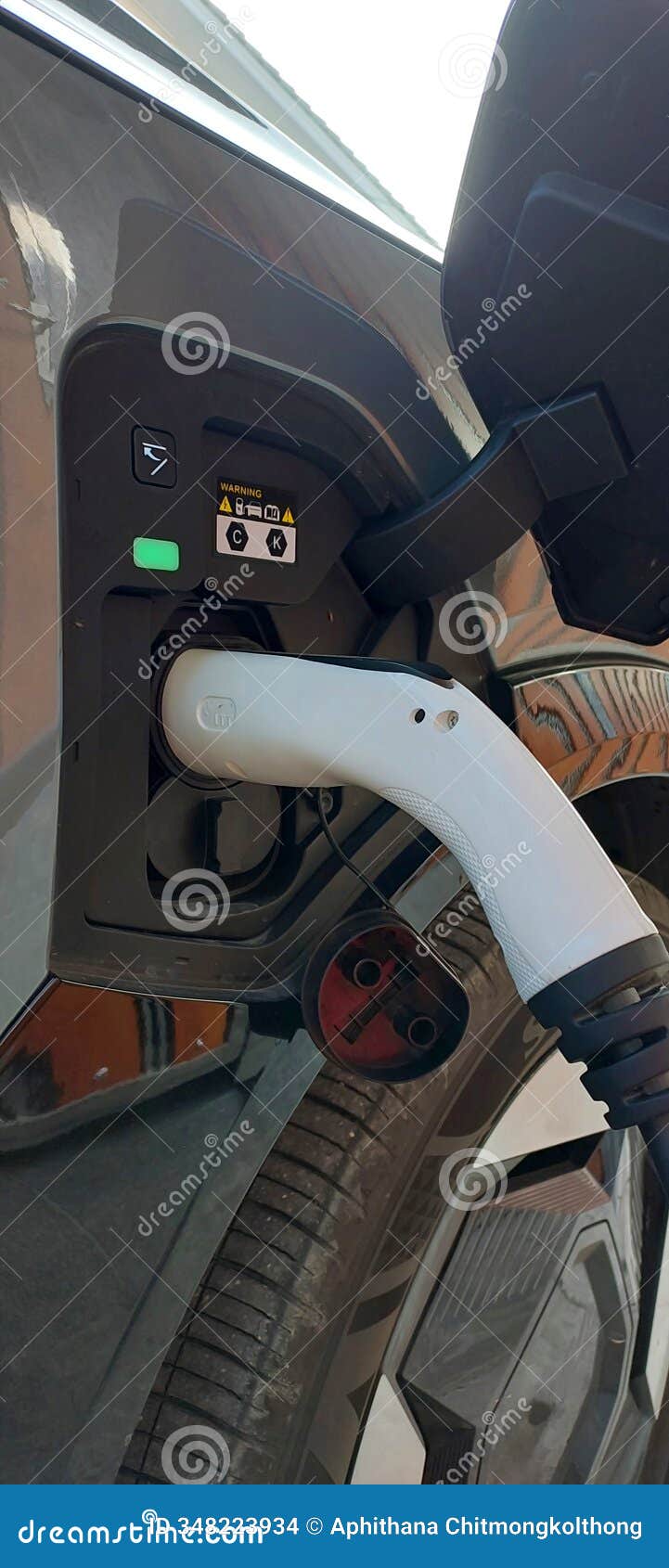 Ev Charger Handle Plugged in Ev Car Recharging Battery Stock Photo ...