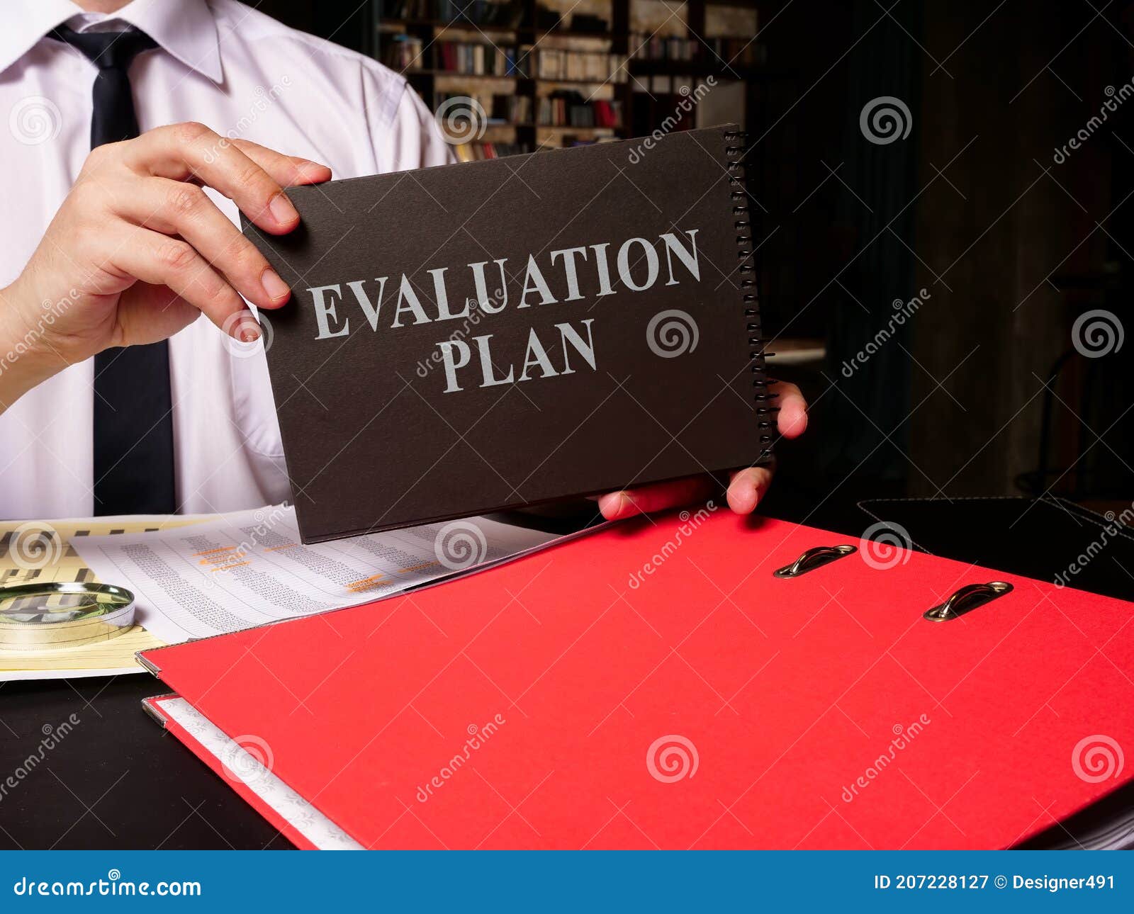 Evaluation Plan is in Hands of the Clerk Who Sits at the Table. Stock ...