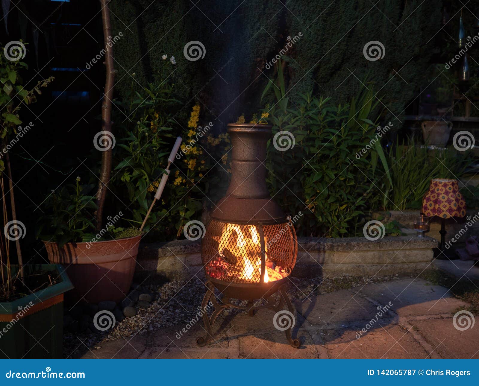 Evening Around the Garden Chiminea Stock Image - Image of holiday ...