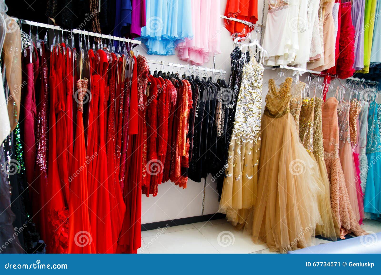 Evening dresses on hangers stock image. Image of elegant - 67734571