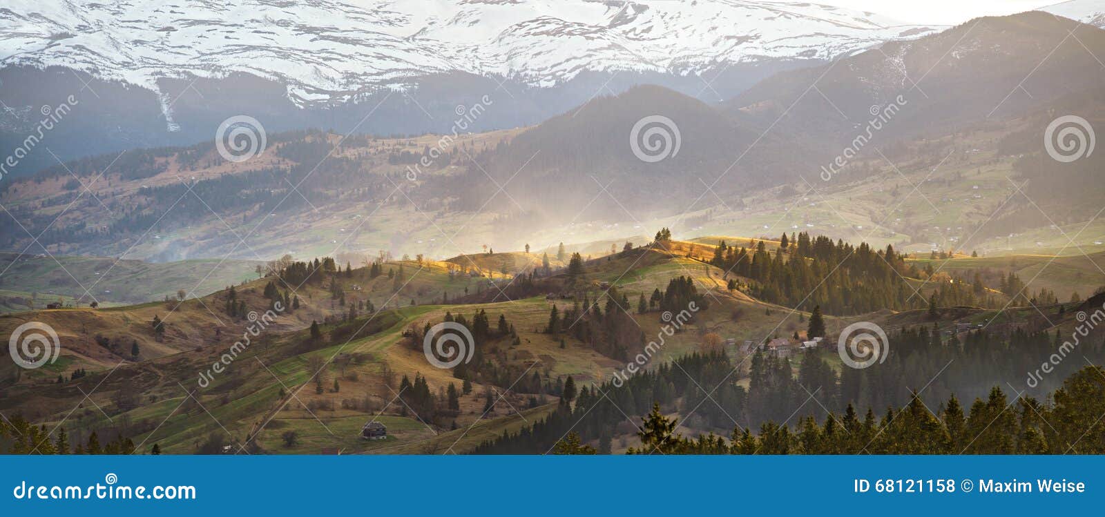Evening Light in Spring Mountains. Snow and Green Fields Stock Photo ...