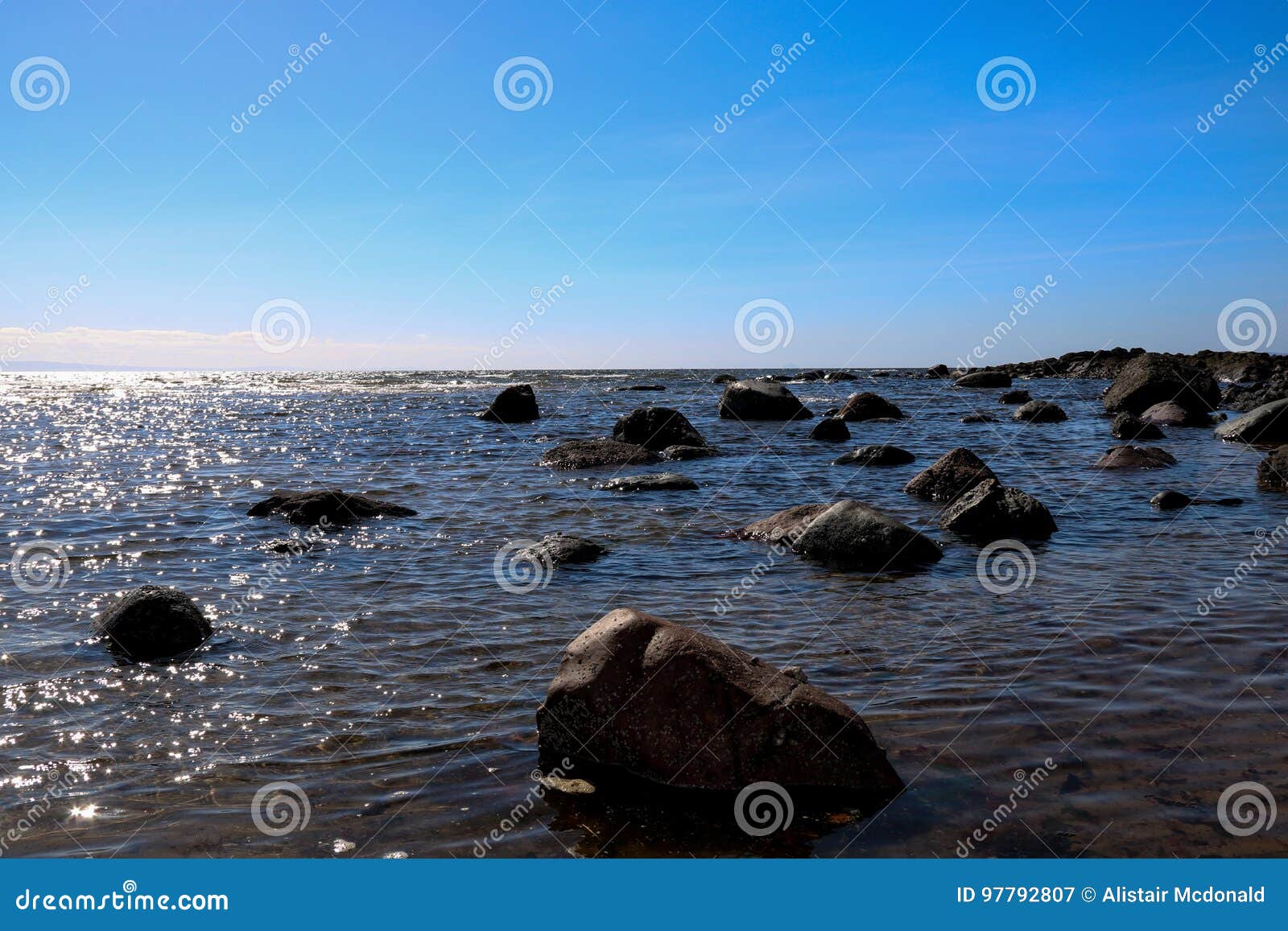 Evening Sunlit Rocks at a Coastal Beach Stock Image - Image of rocks ...