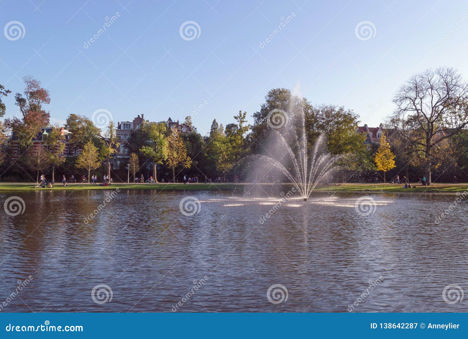 Evening at the Vondelpark with People Relaxing Around Lake with ... Evening at the Vondelpark with People Relaxing Around Lake with ...