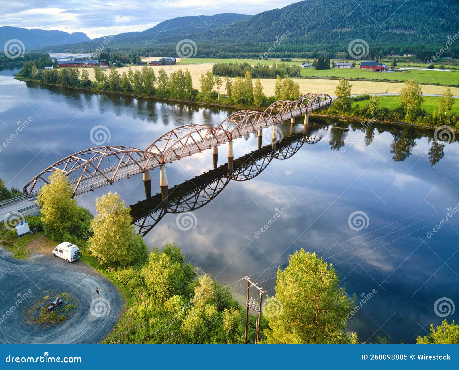 Evenstad Bru Bridge Surrounded by Trees and Clear Reflective Water ...