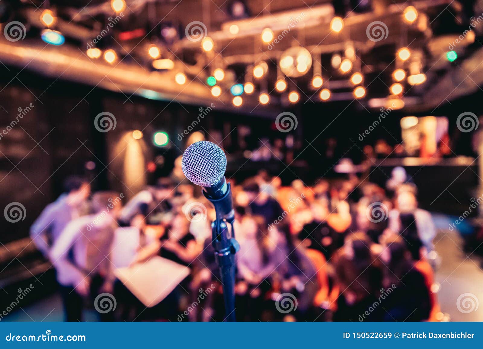 Event Hall: Close Up of Microphone Stand, Seats with Audience in the ...