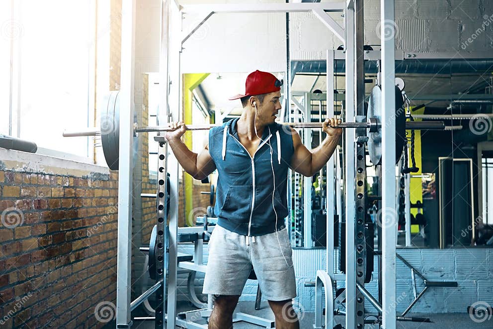 Every Burden is a Blessing. a Man Doing Weight Training at the Gym. Stock Photo - Image of ...