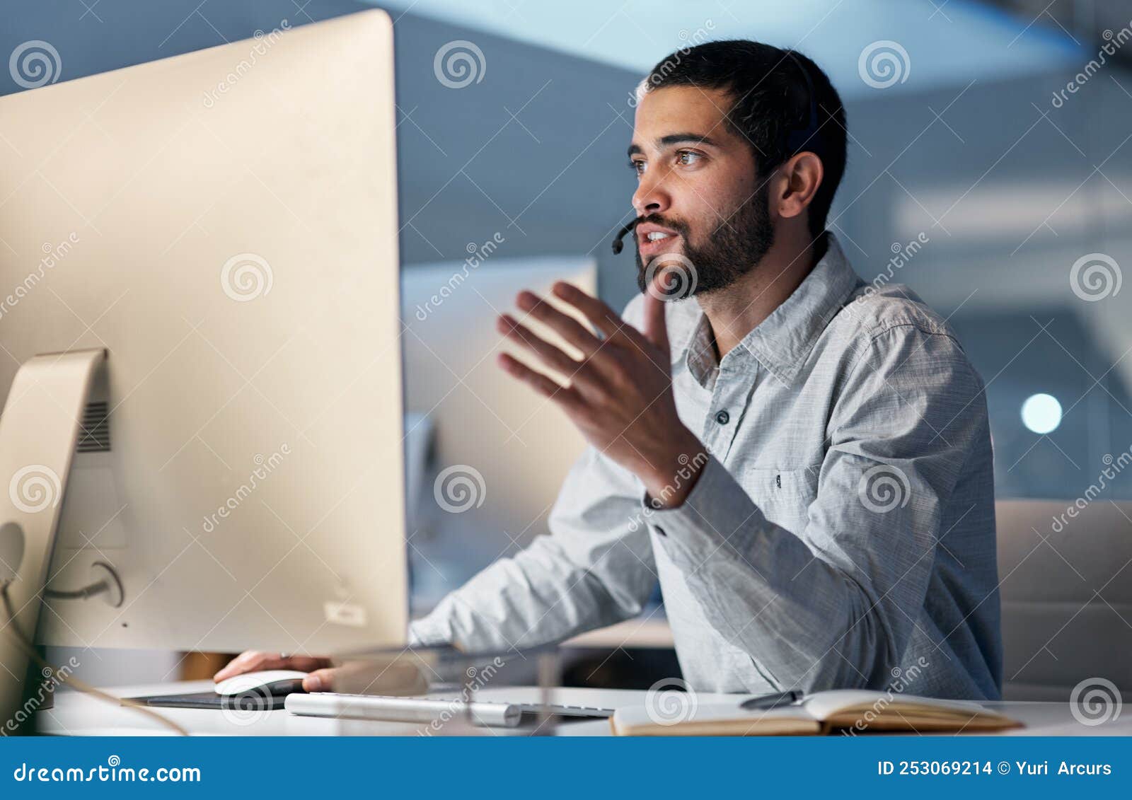 Every Client Deserves To Be Heard. a Young Man Using a Headset and ...