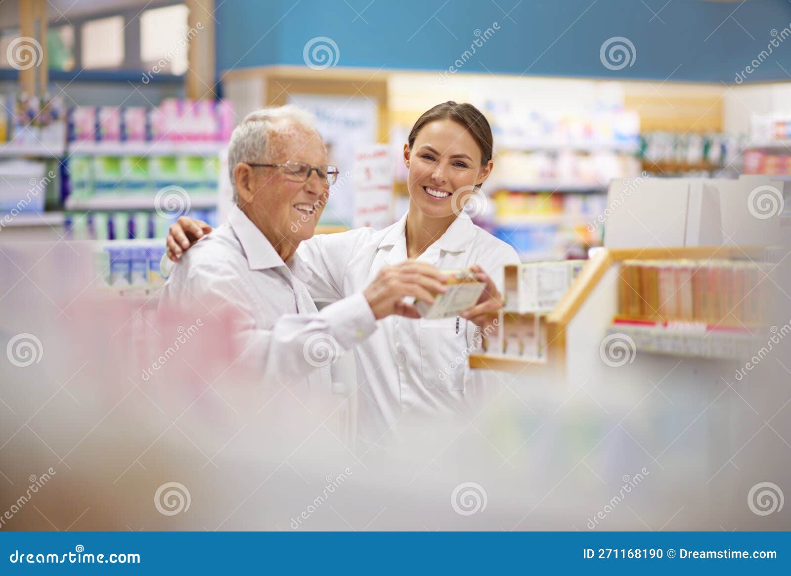 Every Client is an Individual. a Young Pharmacist Helping an Elderly ...