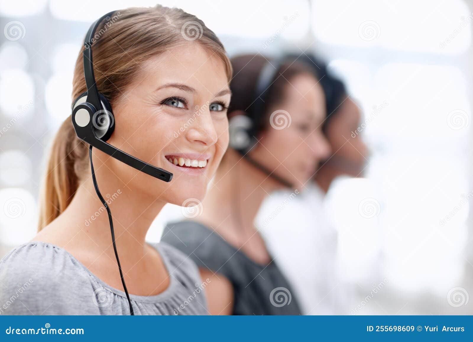 Every Customer is Satisfied. Pretty Young Call Operator Smiling As she ...