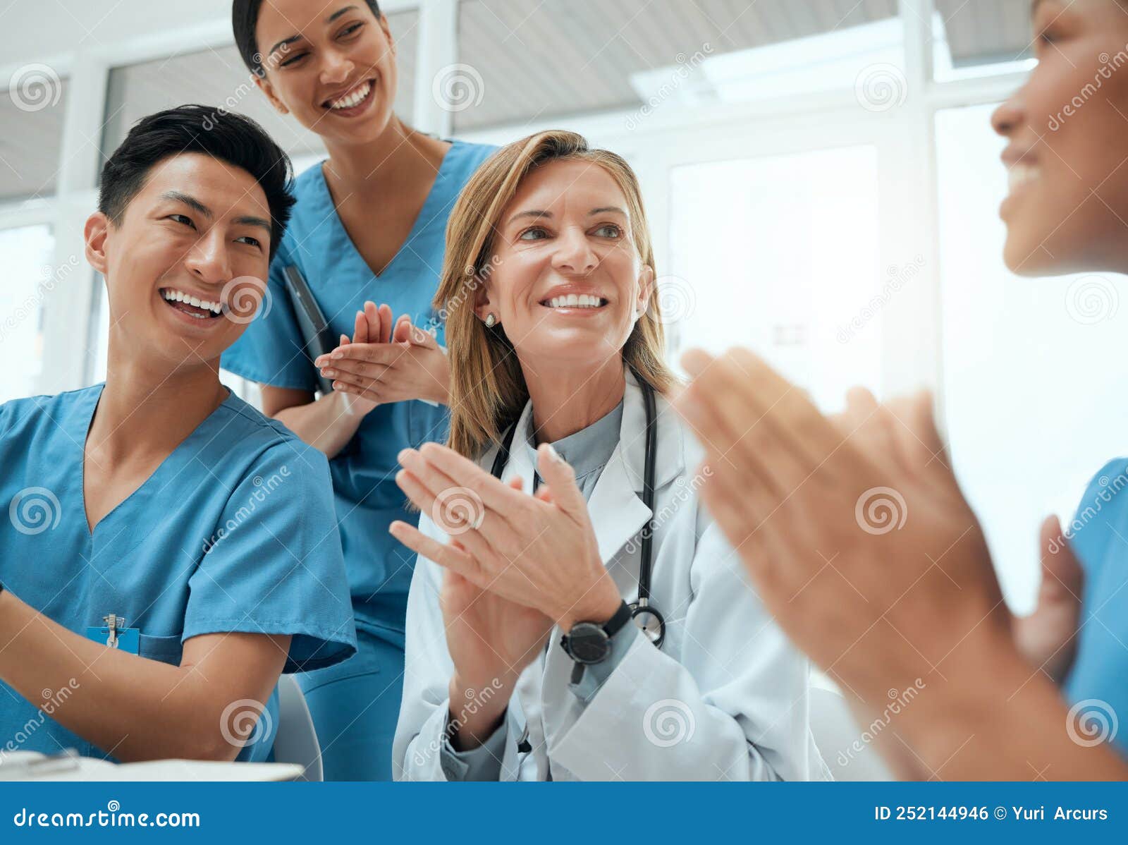 Everyone Deserves the Best Support System. a Group of Doctors Clapping ...