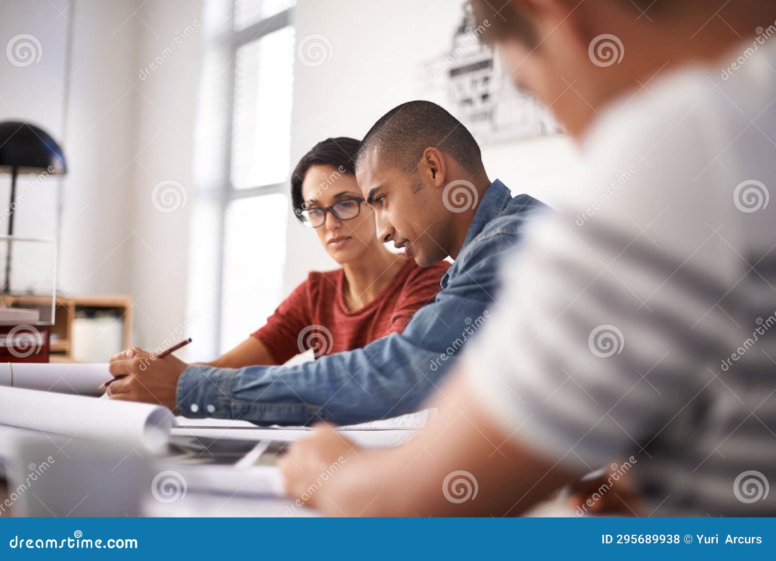 Everyone Pitching in To Complete the Project. a Group of Young ...